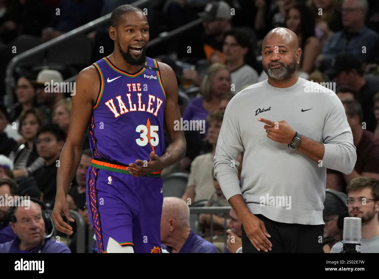 Detroit Pistons head coach JB Bickerstaff talks to Phoenix Suns forward ...