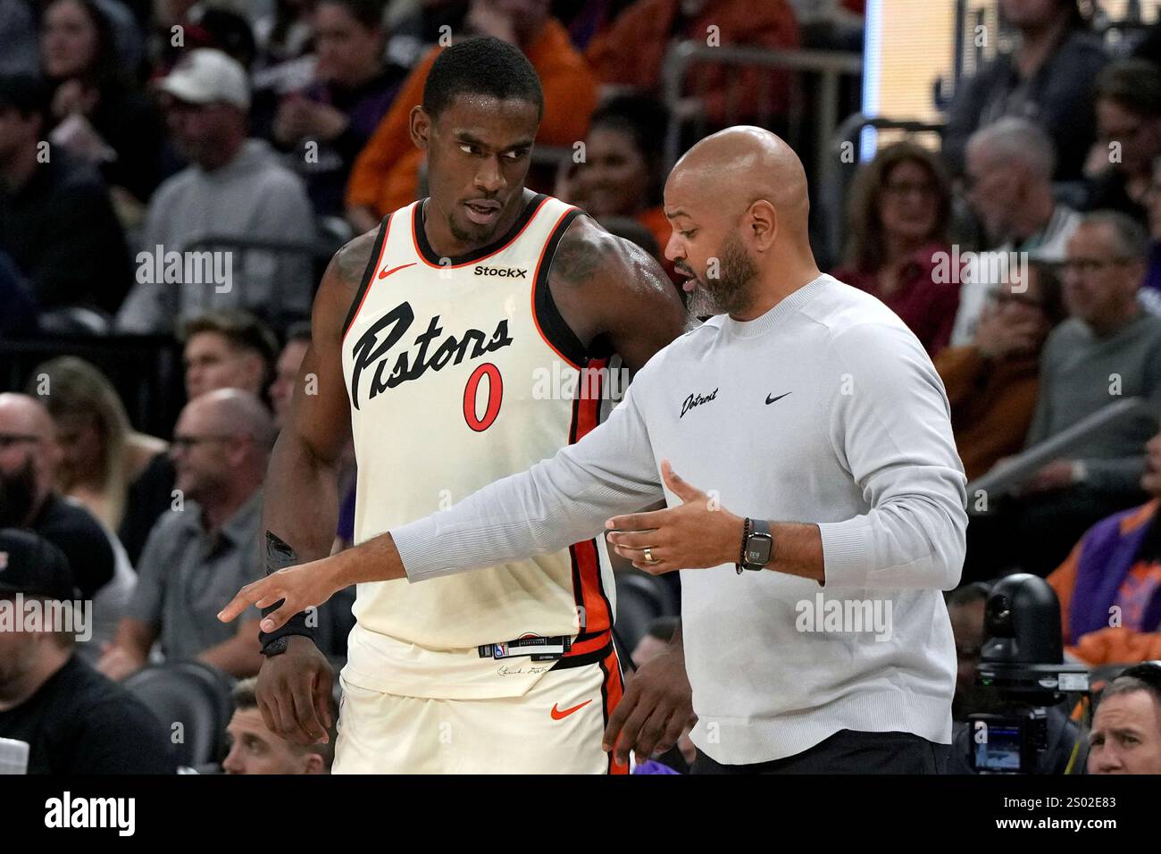 Detroit Pistons head coach JB Bickerstaff talks to center Jalen Duren ...