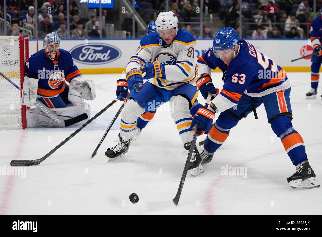 Buffalo Sabres' Sam Lafferty (81) fights for control of the puck with ...