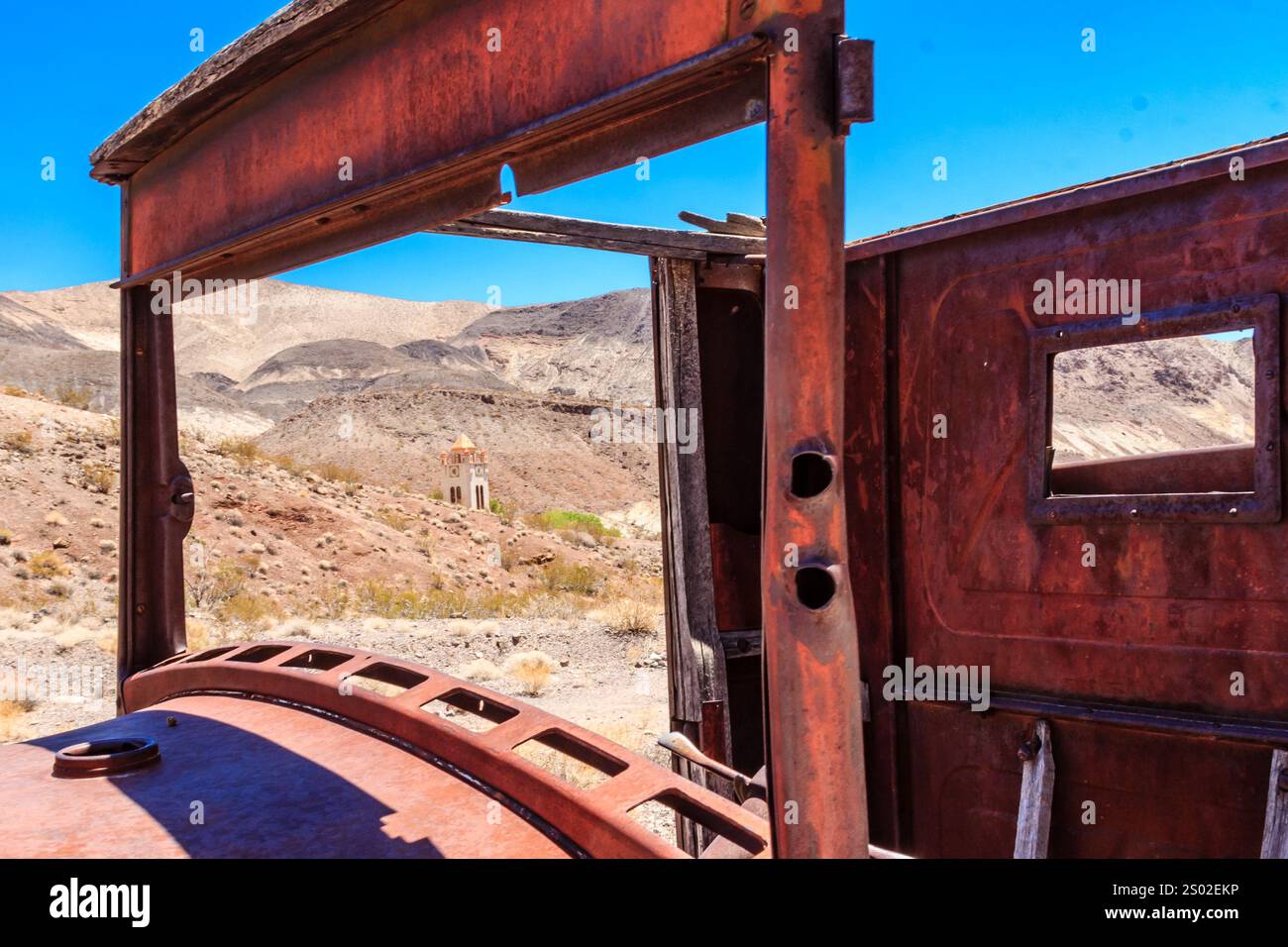 A rusty old train car with a window open. The train car is in the ...