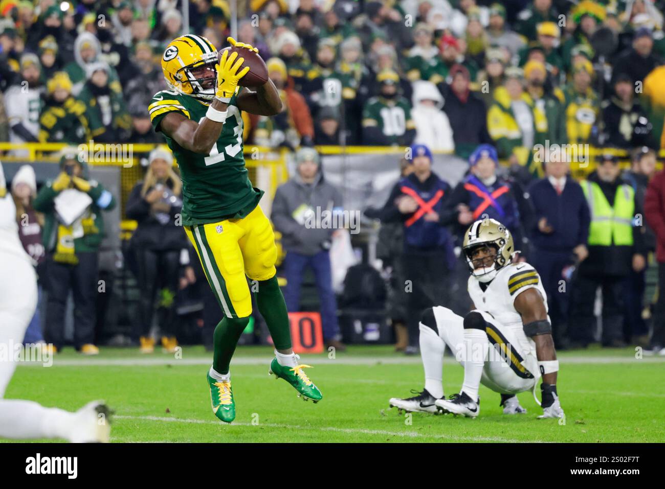 Green Bay Packers wide receiver Dontayvion Wicks (13) pulls in a ...