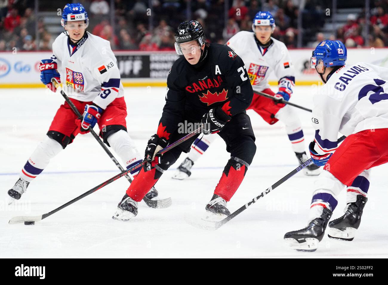 Canada's Calum Ritchie (21) moves the puck around Czechia's Tomas ...