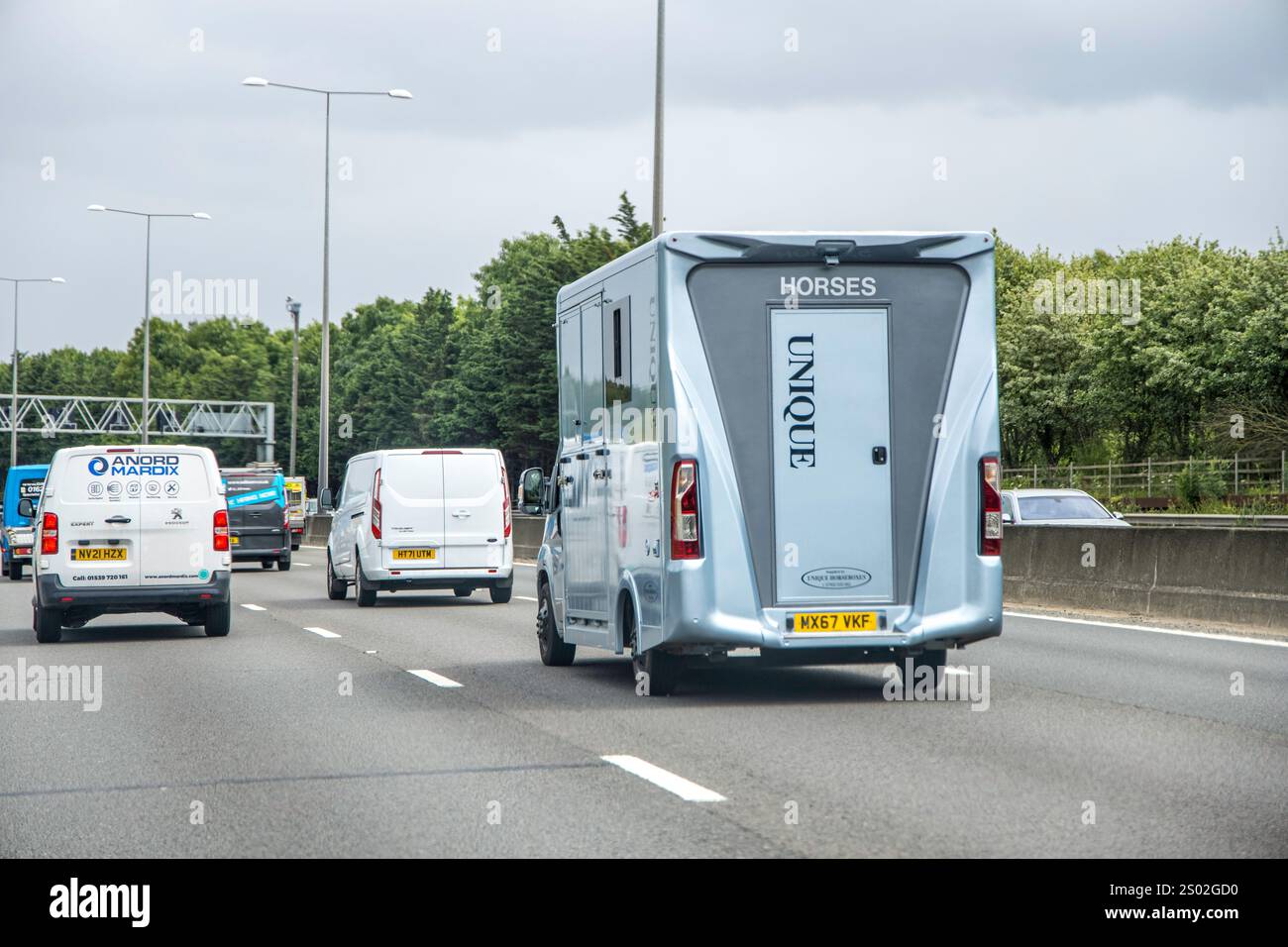London, UK- June 30, 2023: Traffic on M25 motorway with horse carrier ...