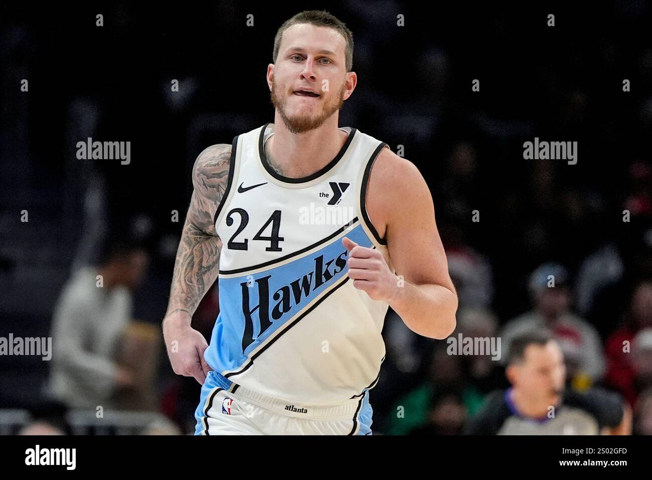 Atlanta Hawks guard Garrison Mathews (24) runs after hitting a thre ...