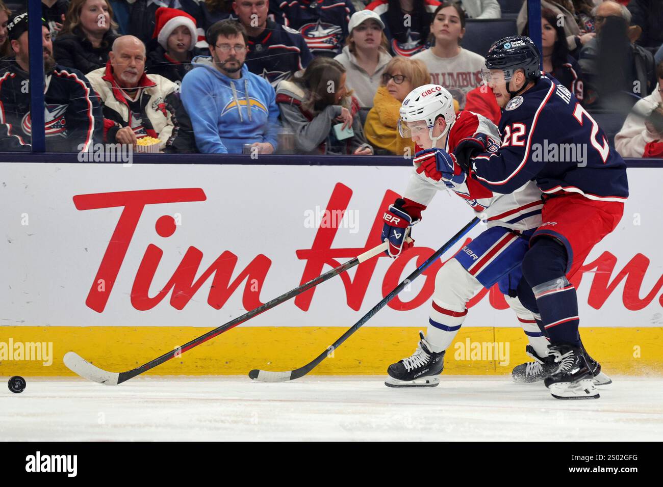 Columbus Blue Jackets defenseman Jordan Harris, right, works for the ...