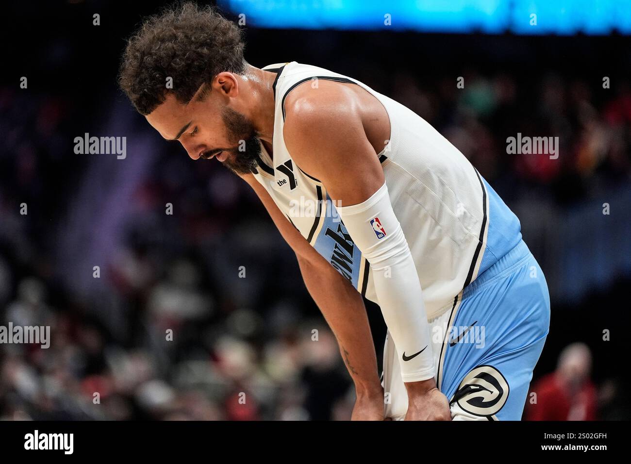 Atlanta Hawks guard Trae Young (11) stands on the court against the ...