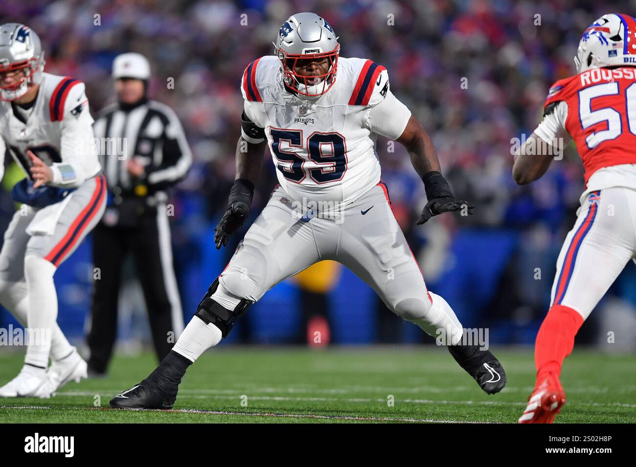 New England Patriots tackle Vederian Lowe (59) blocks during the first ...