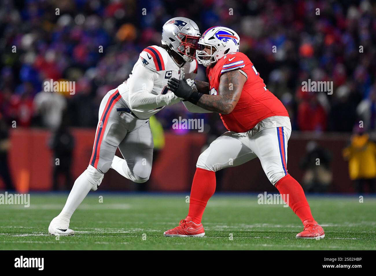 New England Patriots defensive end Deatrich Wise Jr., left, rushes ...