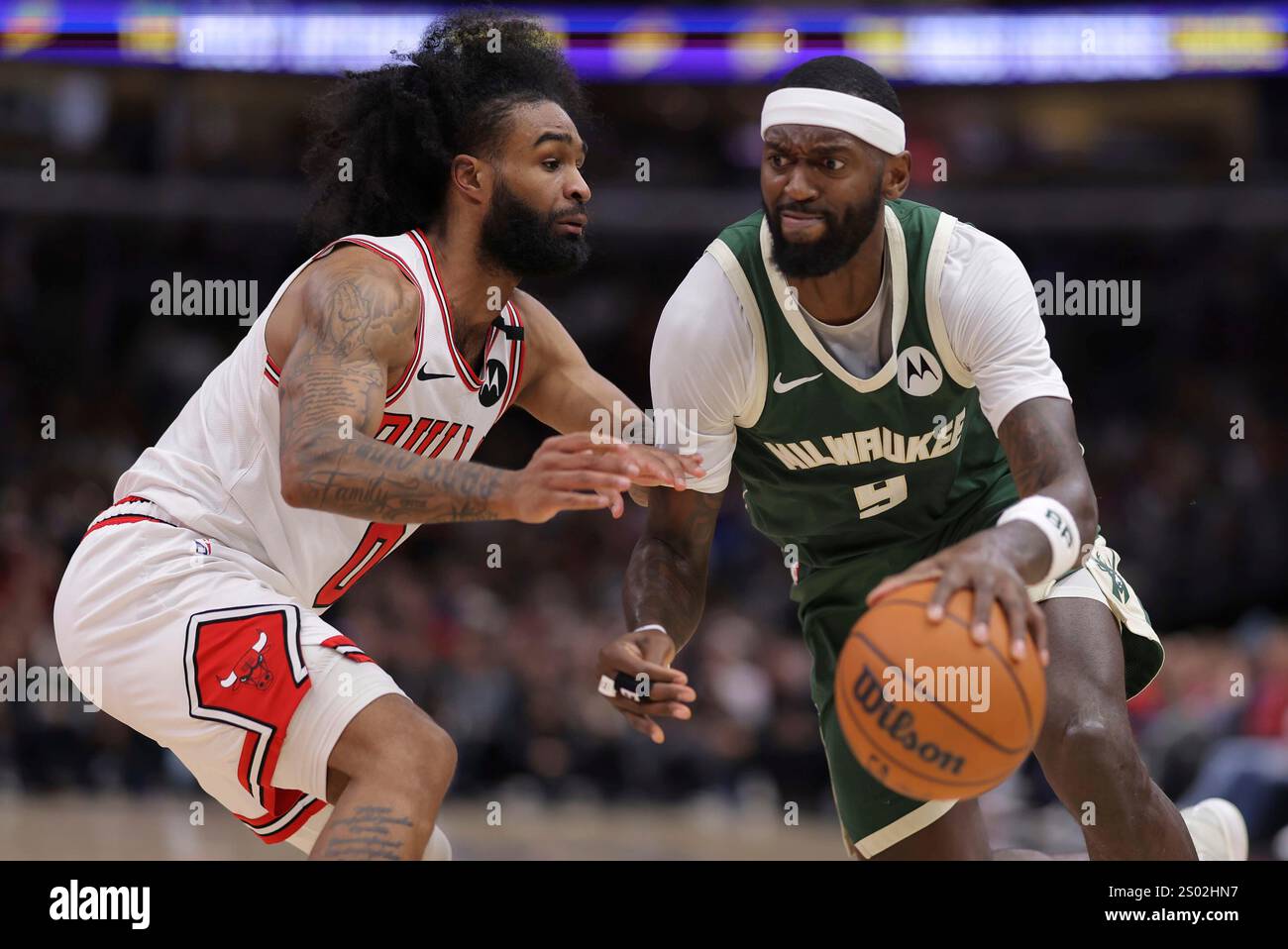 Chicago Bulls guard Coby White, left, guards against Milwaukee Bucks ...