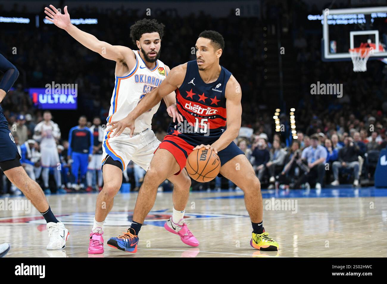 Washington Wizardsn guard Malcolm Brogdon, right, drives past Oklahoma ...