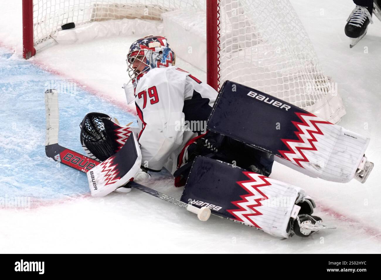 Washington Capitals goaltender Charlie Lindgren lays on the ice after ...