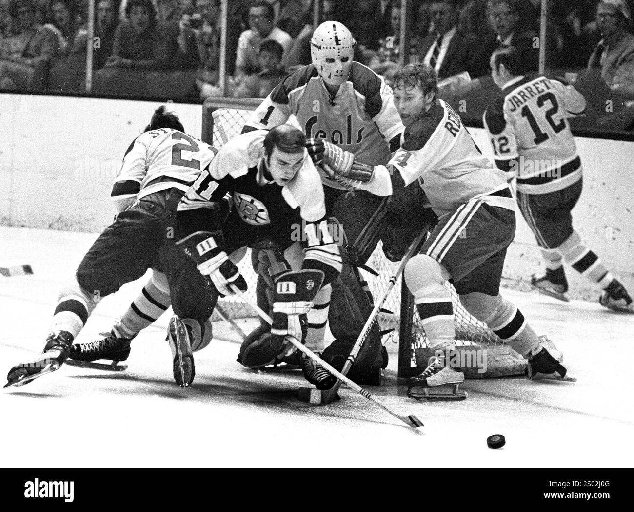 California Golden Seals battle the Boston Bruins Wayne Carleton (11 ...