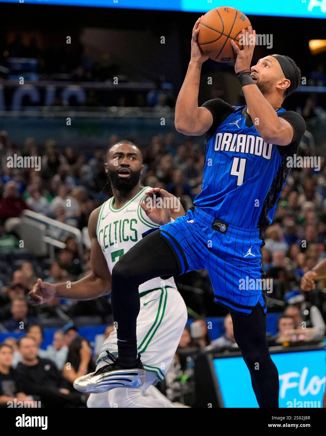 Orlando Magic guard Jalen Suggs (4) makes a shot as he gets past Boston ...