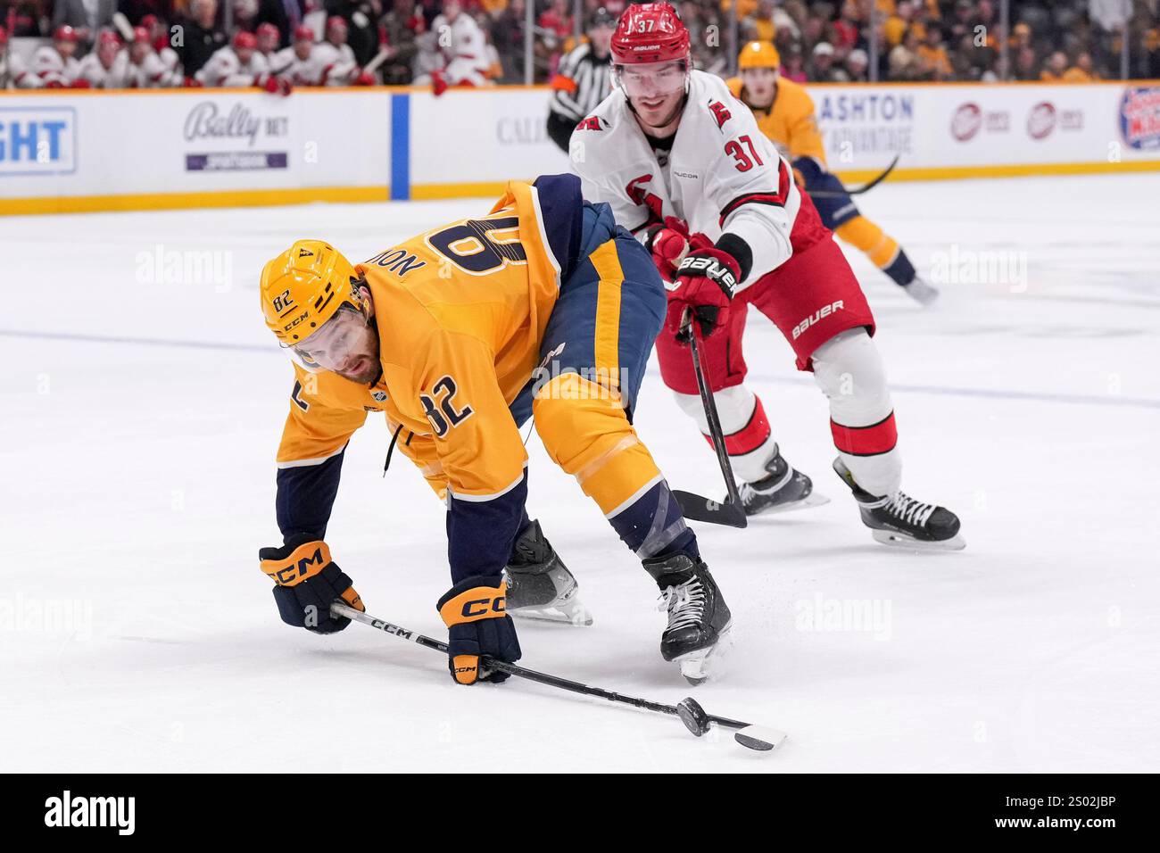 Nashville Predators center Tommy Novak (82) chases the puck past ...