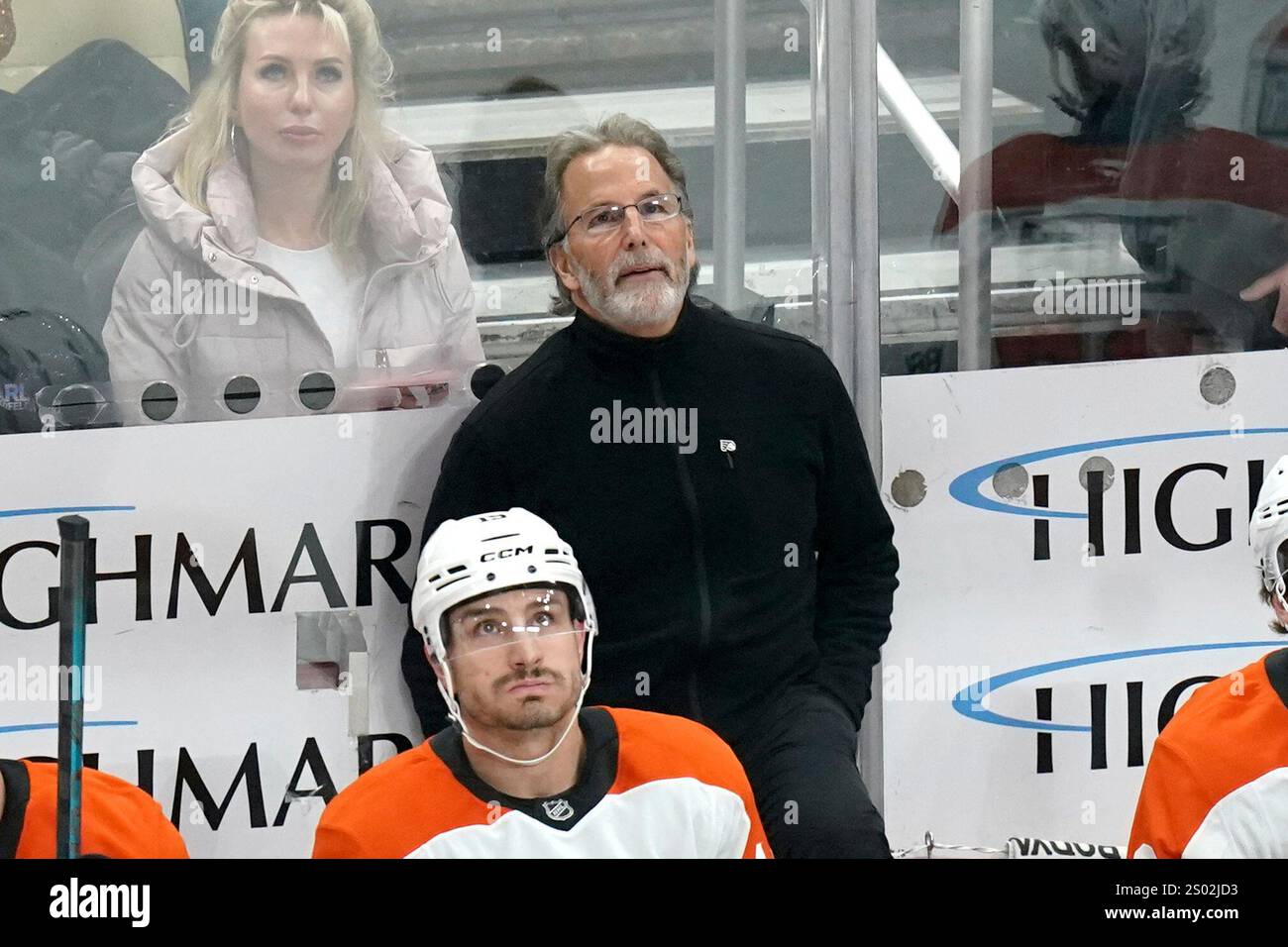 Philadelphia Flyers head coach John Tortorella stands behind his bench ...