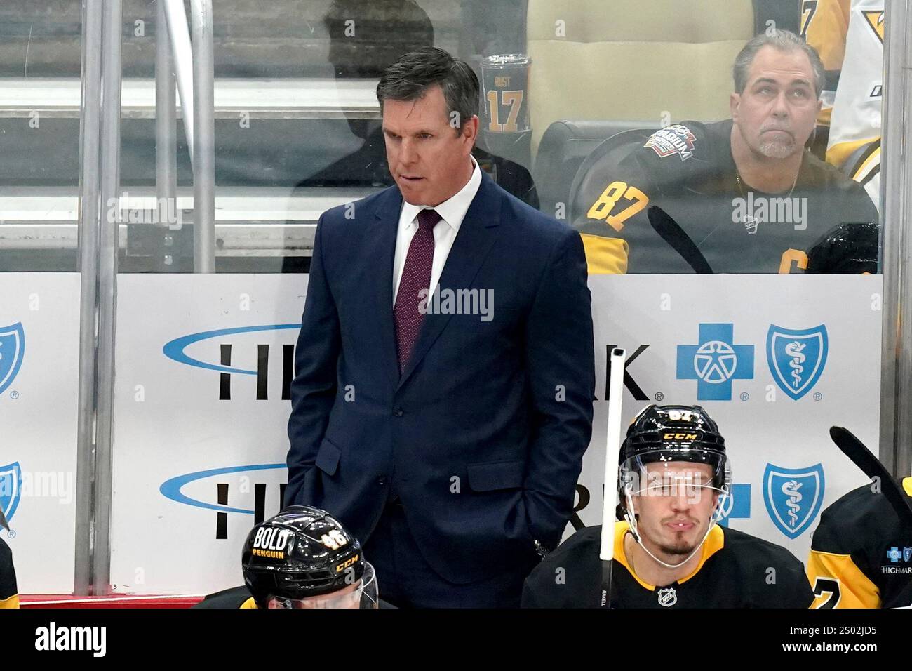 Pittsburgh Penguins head coach Mike Sullivan stands behind his bench ...