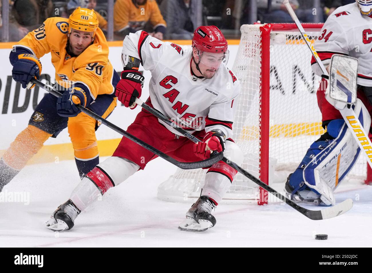 Carolina Hurricanes defenseman Dmitry Orlov (7) skates the puck past ...