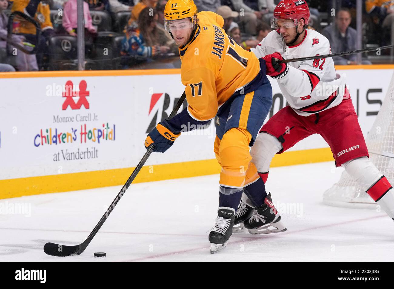Nashville Predators center Mark Jankowski (17) skates the puck past ...