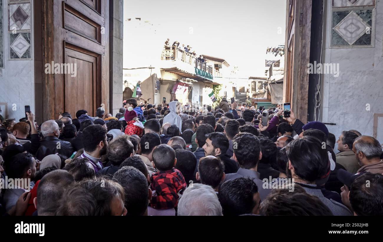 Hama, Syria. 13th Dec, 2024. Crowds pictured following the first Friday ...