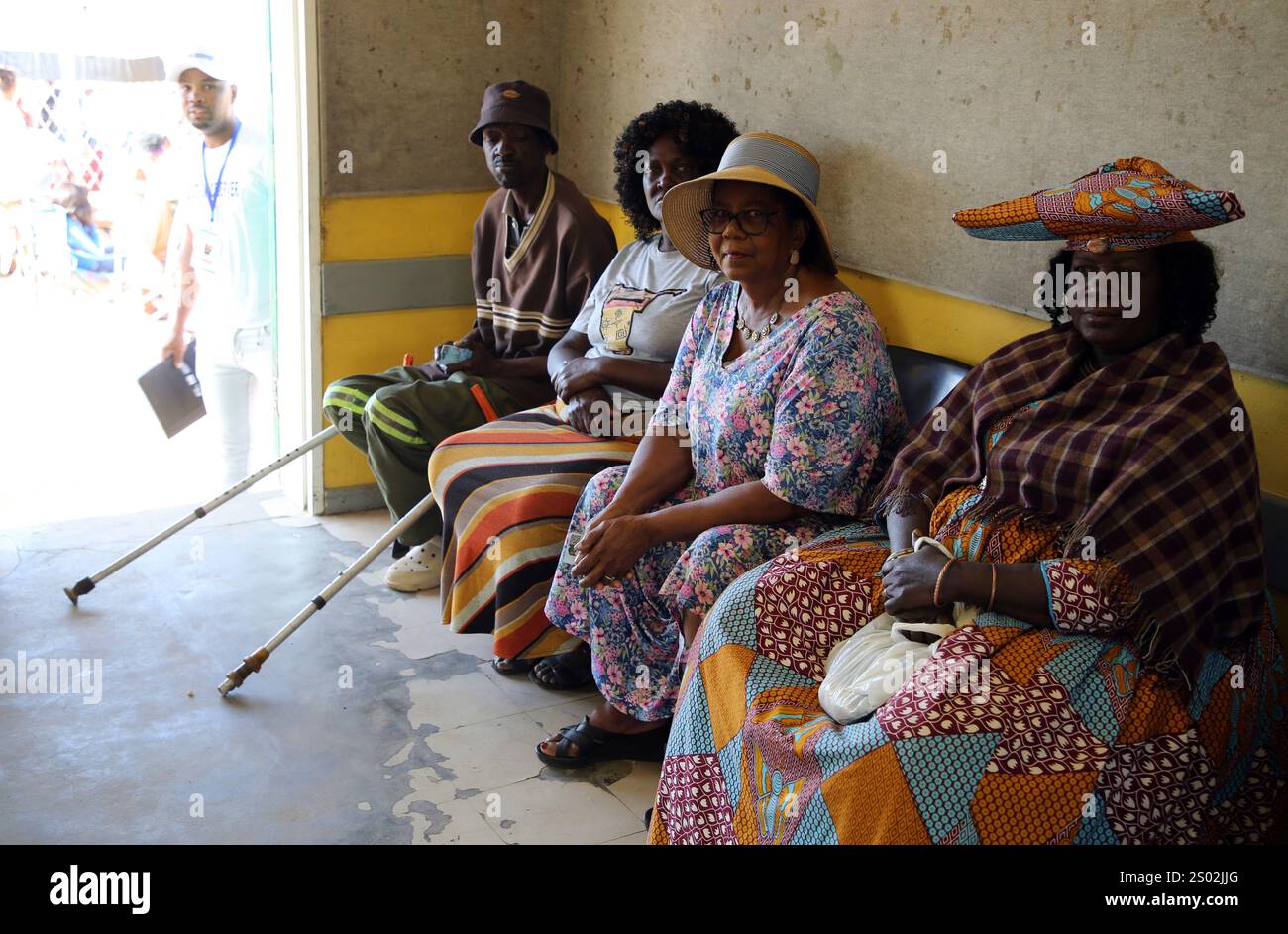 FILE - Namibians queue to cast their votes in a presidential election ...