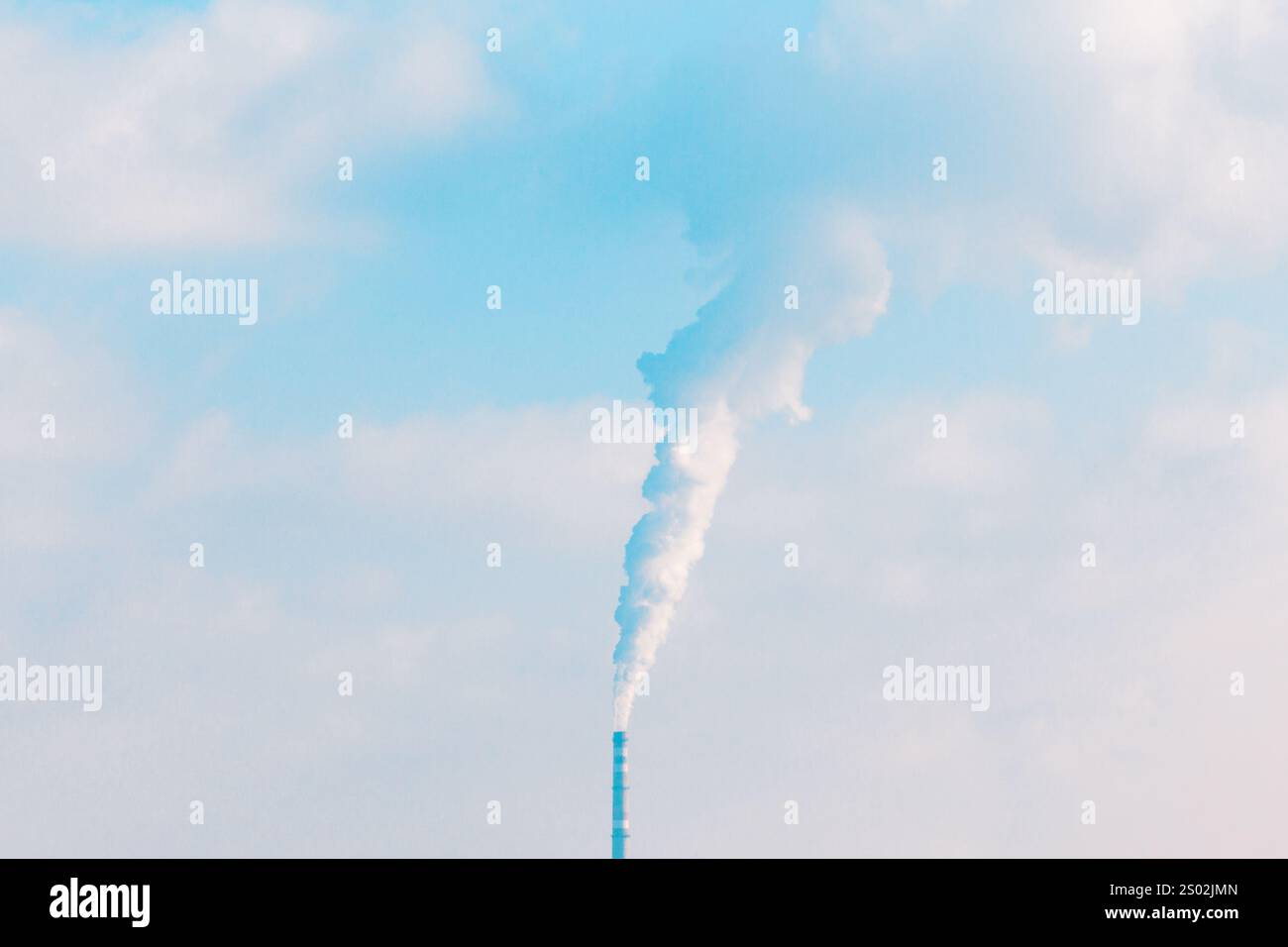 Factory chimney releasing smoke into the atmosphere. Smoke billowing ...