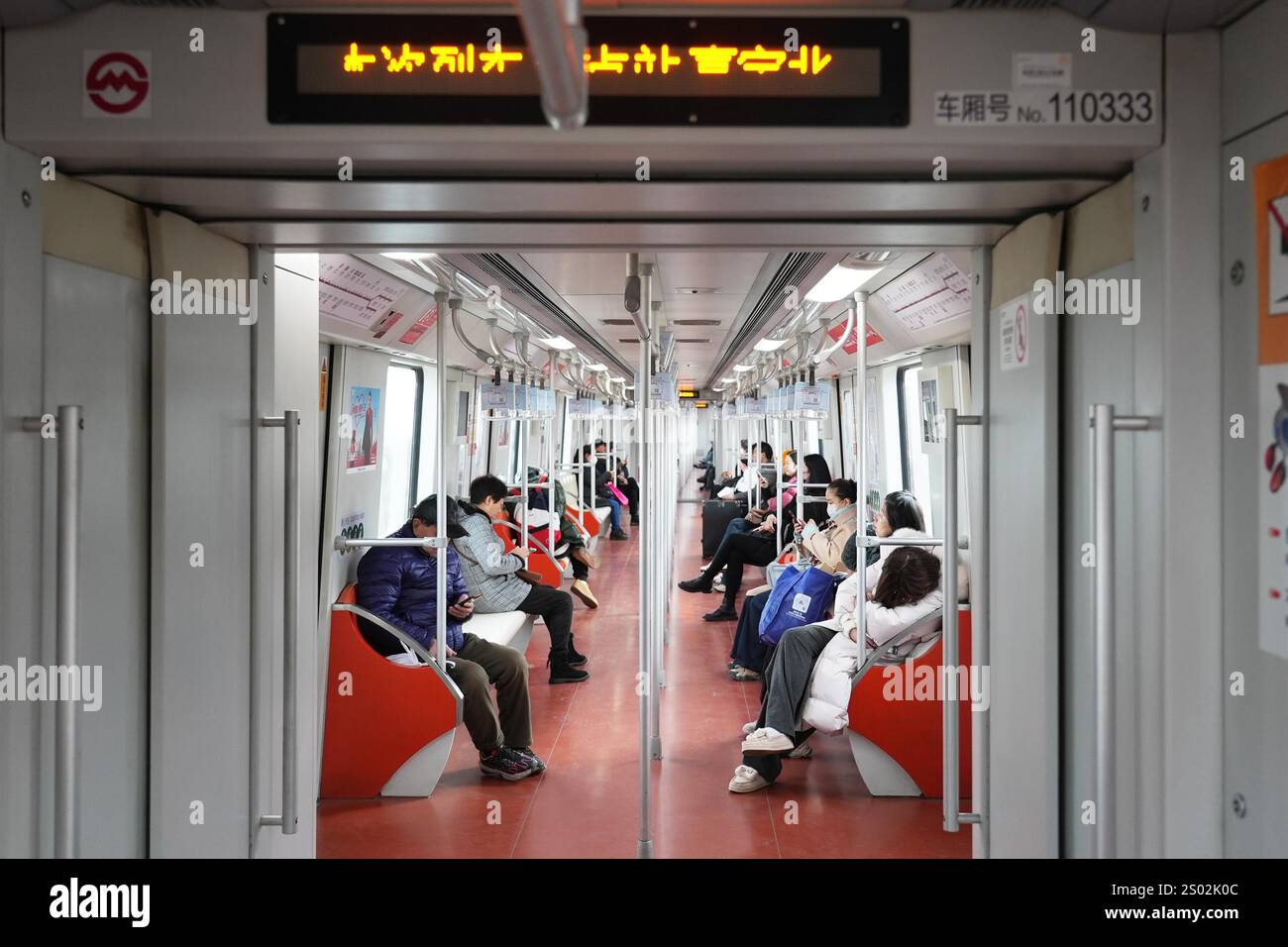 Shanghai,China.23th December 2024. Passengers ride a metro train on the ...