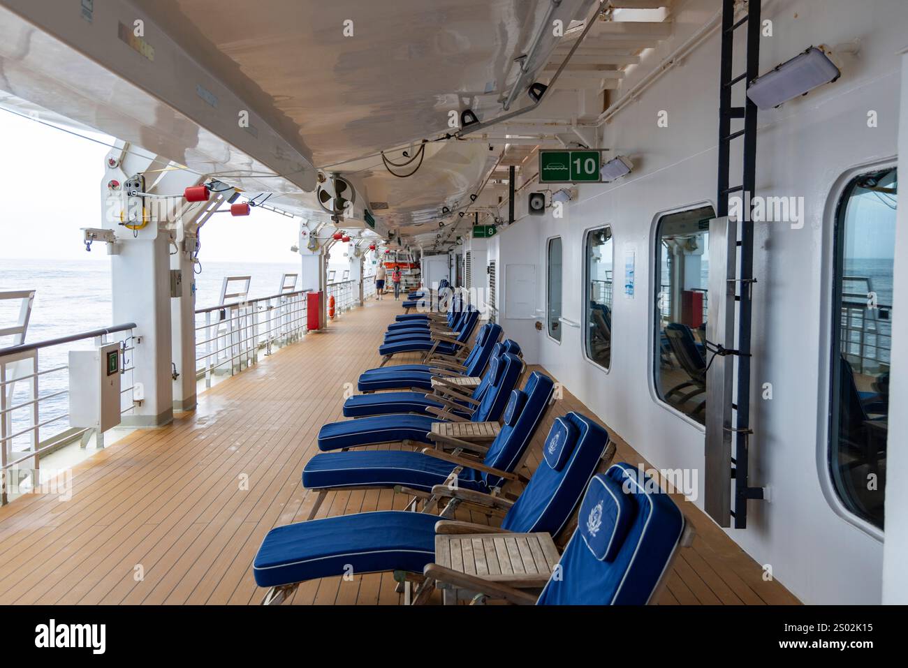 Cunard Queen Elizabeth cruise ship, promenade deck with sun loungers ...