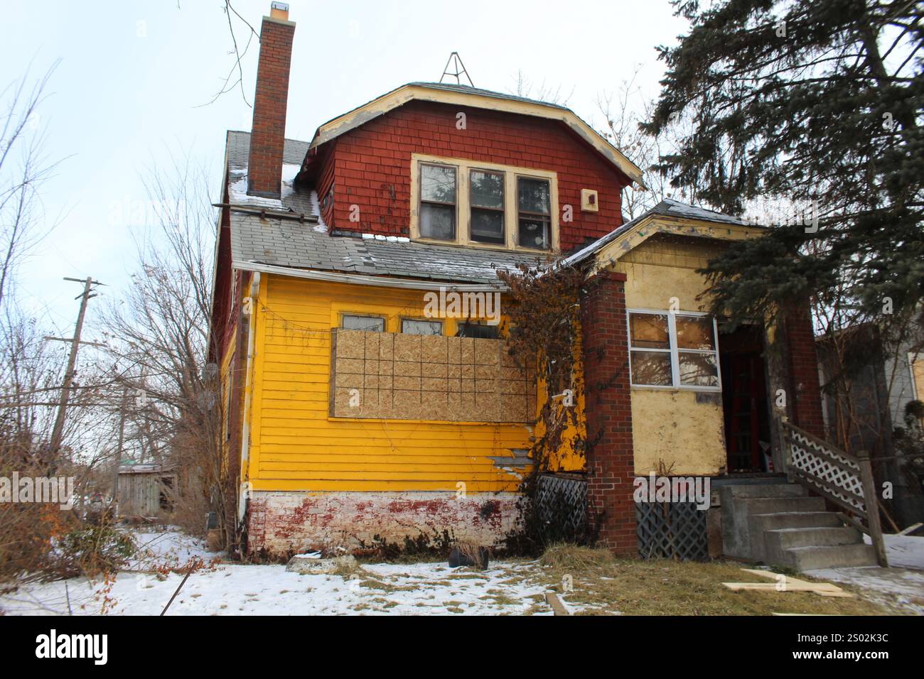 Abandoned and boarded-up bright orange home in the Franklin Park ...