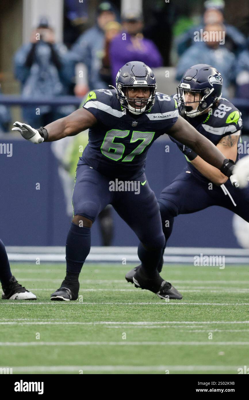 Seattle Seahawks offensive tackle Charles Cross (67) blocks against the ...