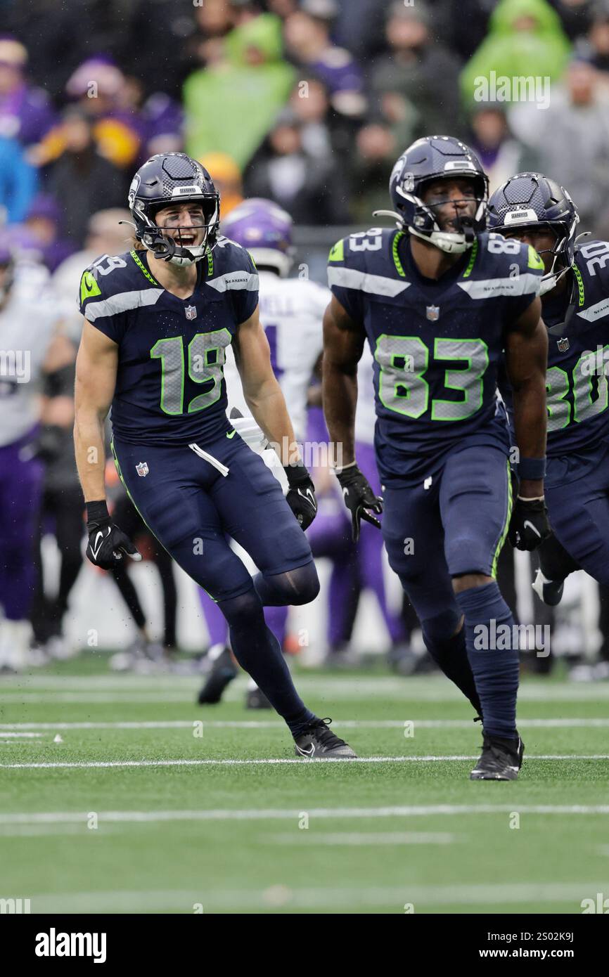 Seattle Seahawks wide receiver Jake Bobo (19) and wide receiver Dareke Young (83) reacts to a ...
