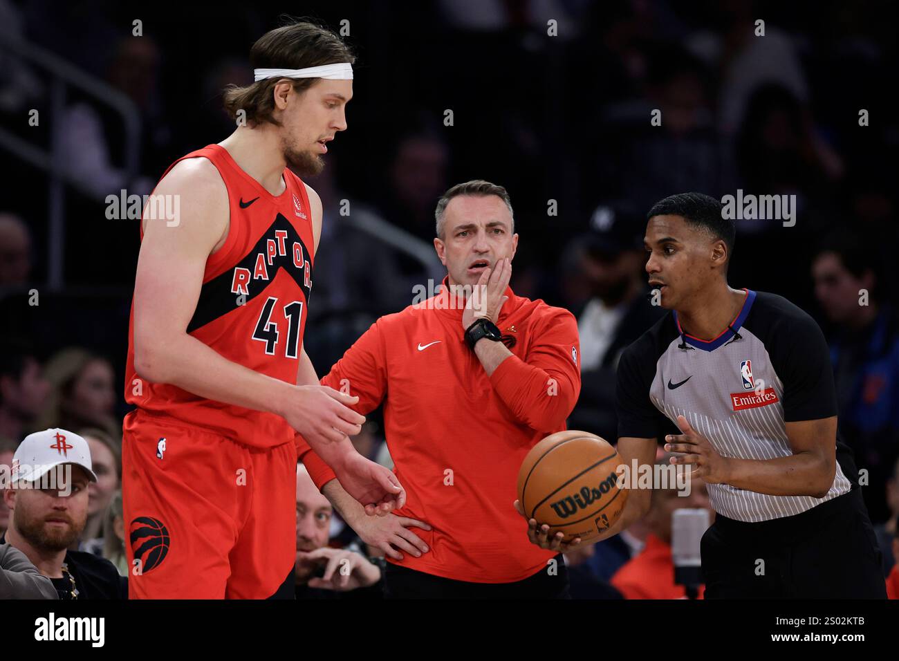 Toronto Raptors head coach Darko Rajakovic, center, reacts as Kelly ...
