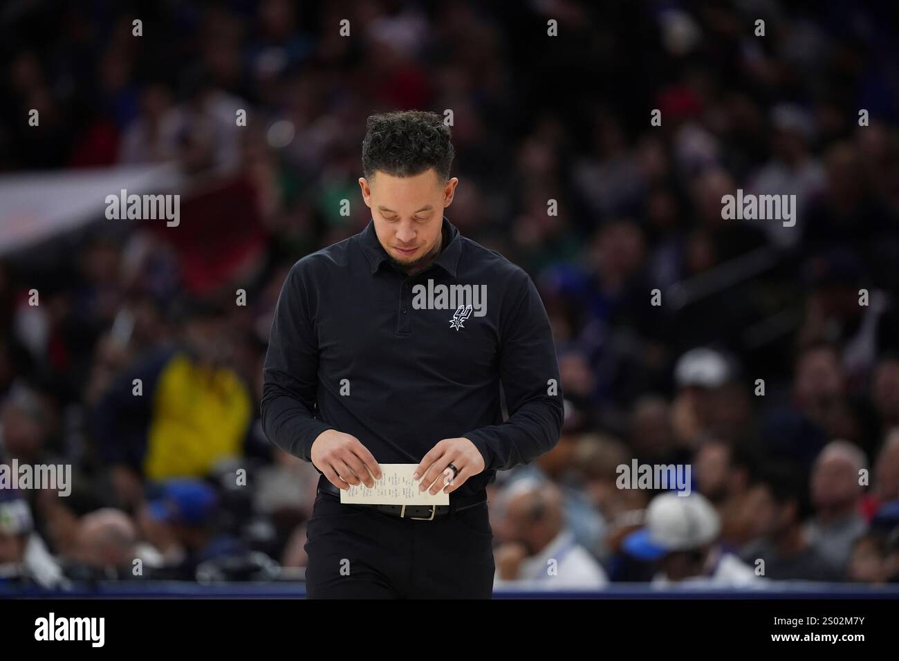 San Antonio Spurs' Mitch Johnson coaches during an NBA basketball game ...