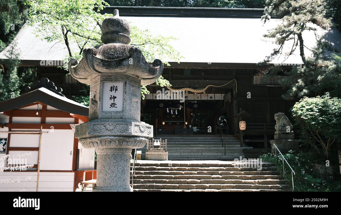 FujiKawaguchiko, Japan- May 17 2024: Japanese shrine inside the forest ...