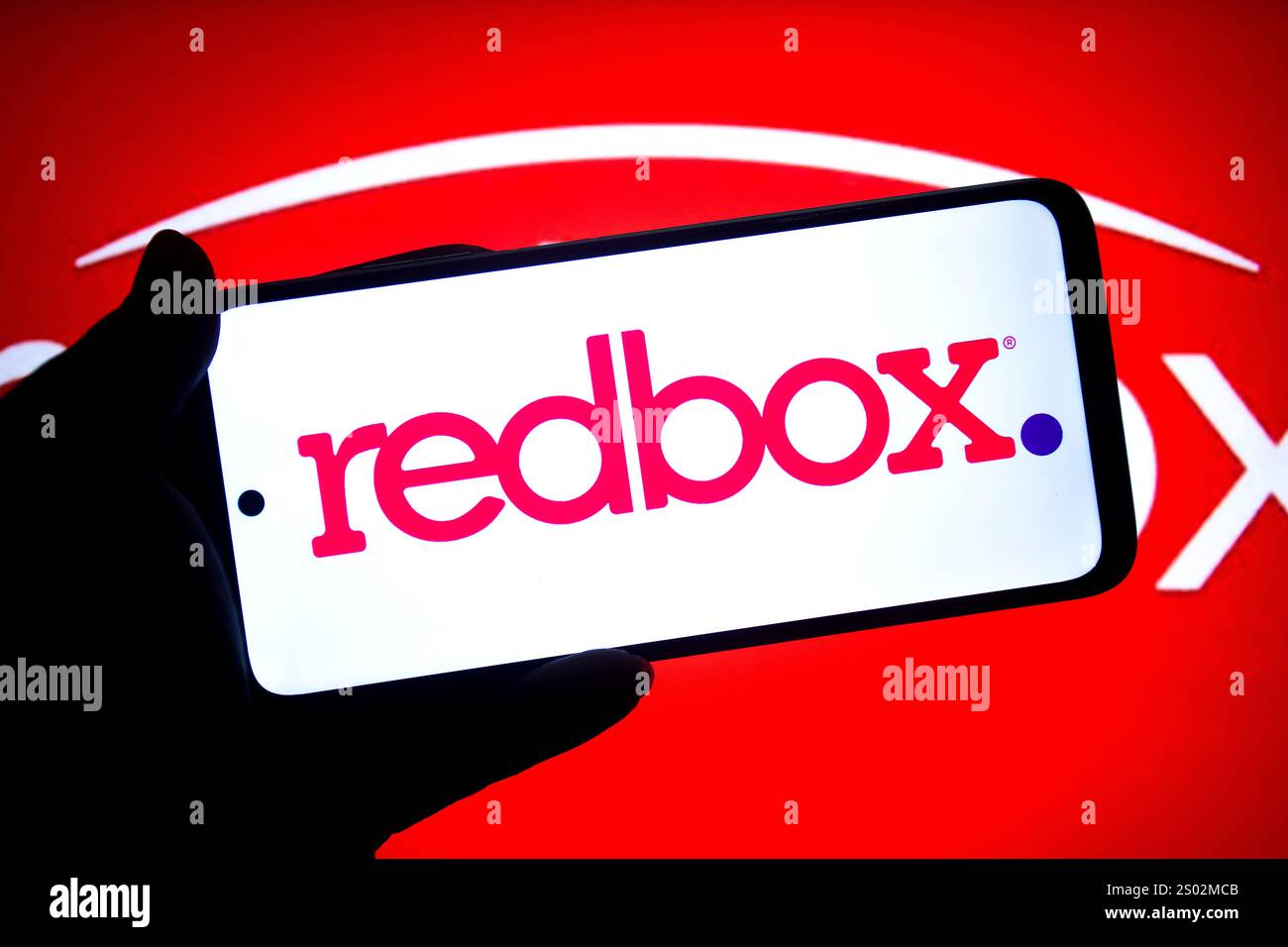 India. 17th Dec, 2024. In this photo illustration, a Redbox logo is seen displayed on a ...
