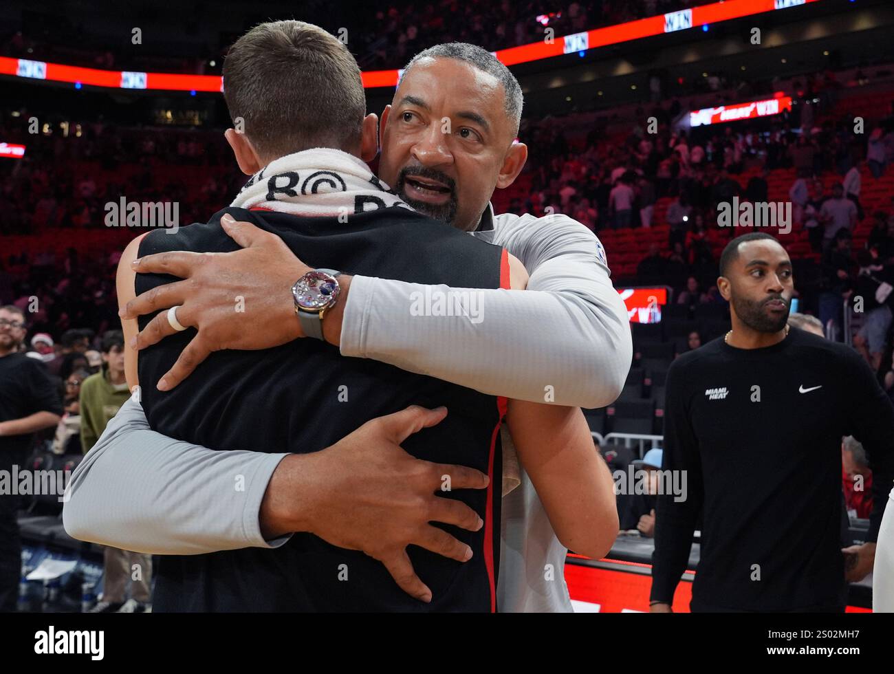 Brooklyn Nets assistant coach Juwan Howard, front right, hugs Miami ...
