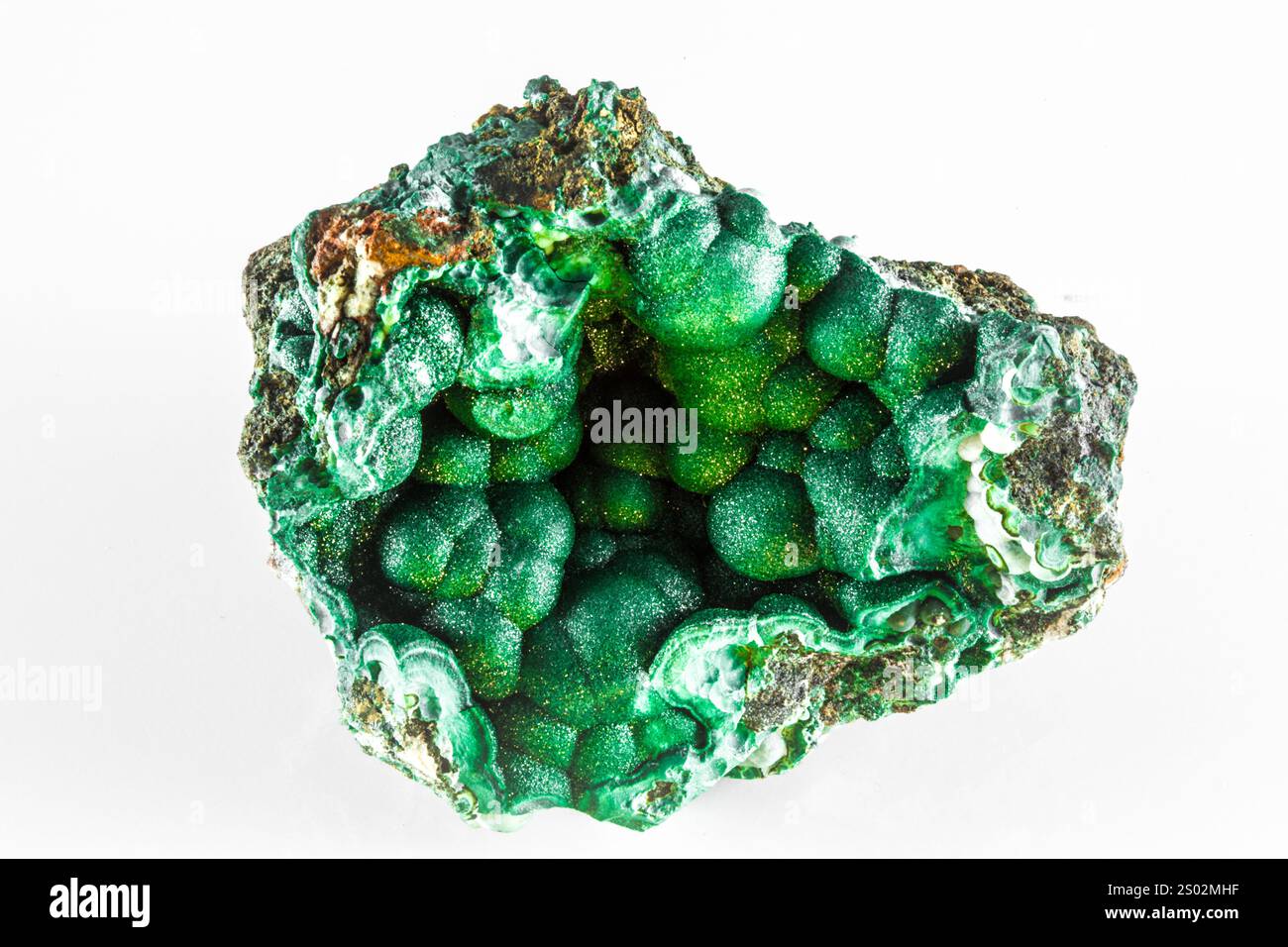 A green Malchite Mineral rock with a hole in the middle. The rock is ...