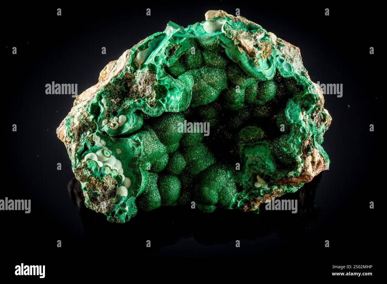 A large green Machite mneral rock with a hole in the middle. The rock ...