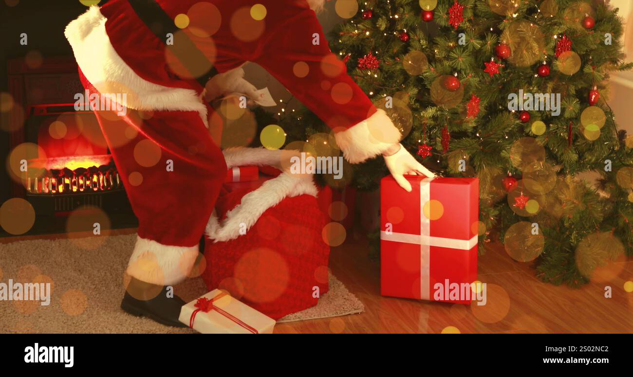 Image of spots of light over christmas tree and santa claus with ...