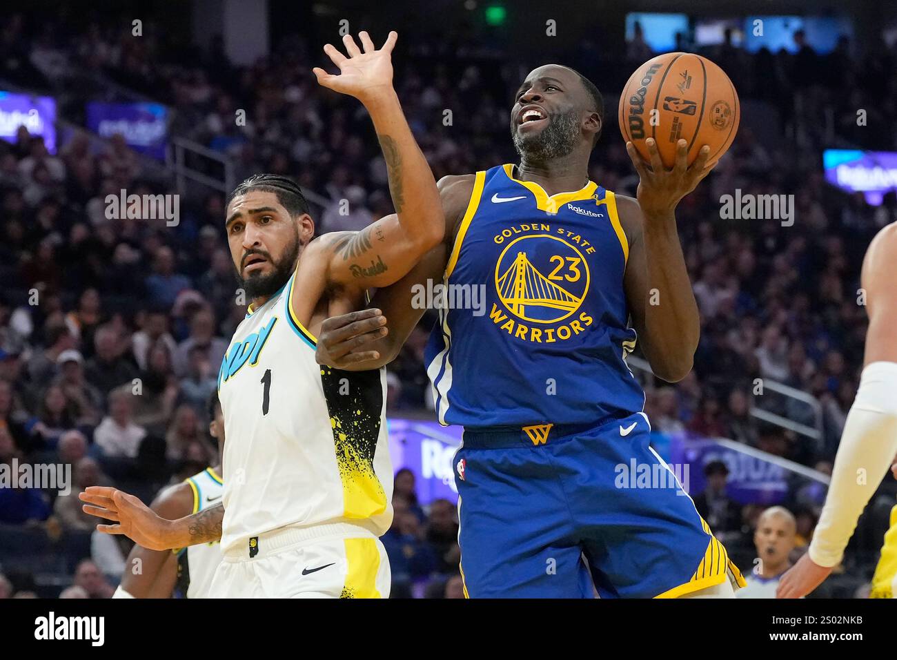 Golden State Warriors forward Draymond Green (23) shoots against Indiana Pacers forward Obi ...