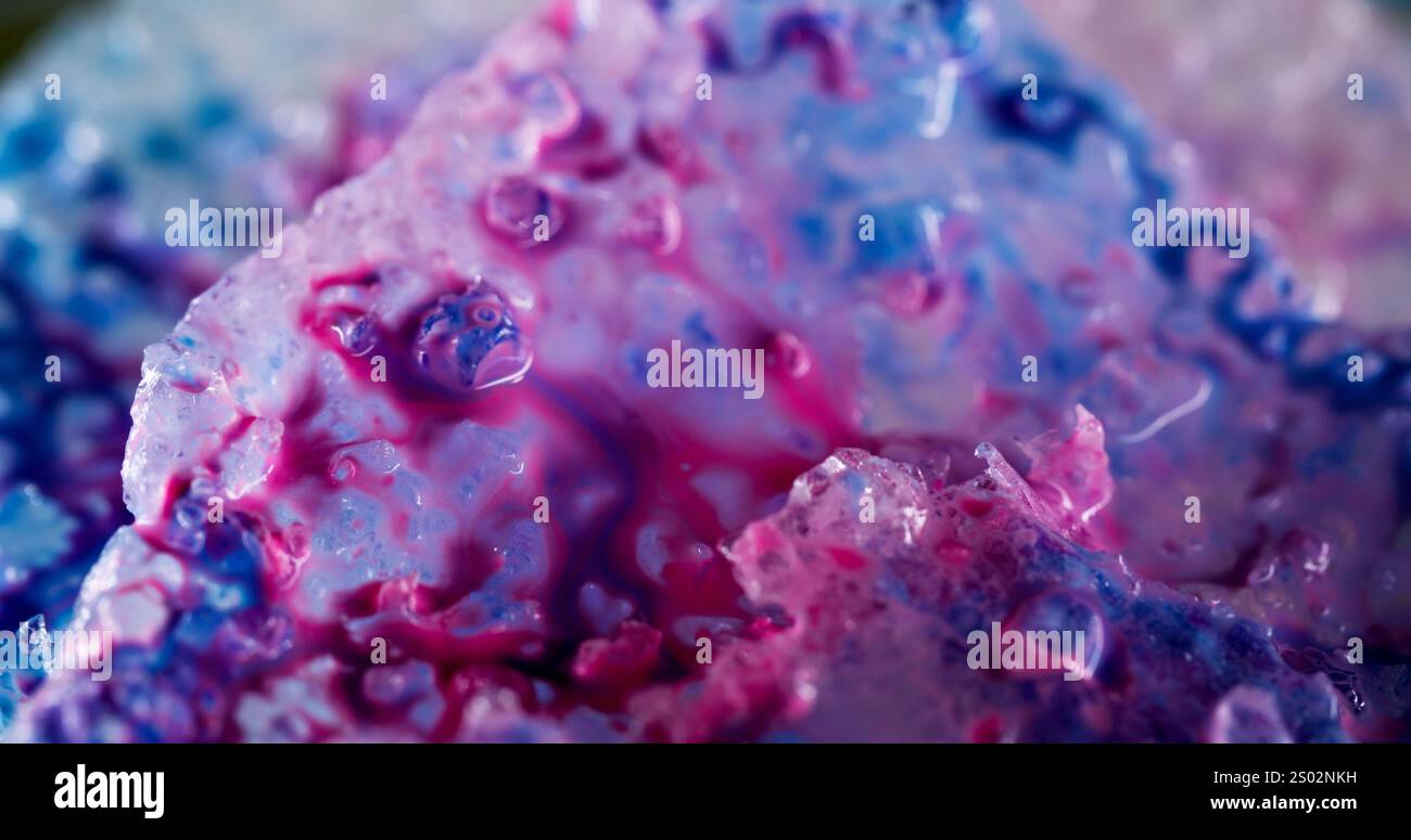 Ink liquid drop. Abstract ice. Blue pink color water blending flow ...