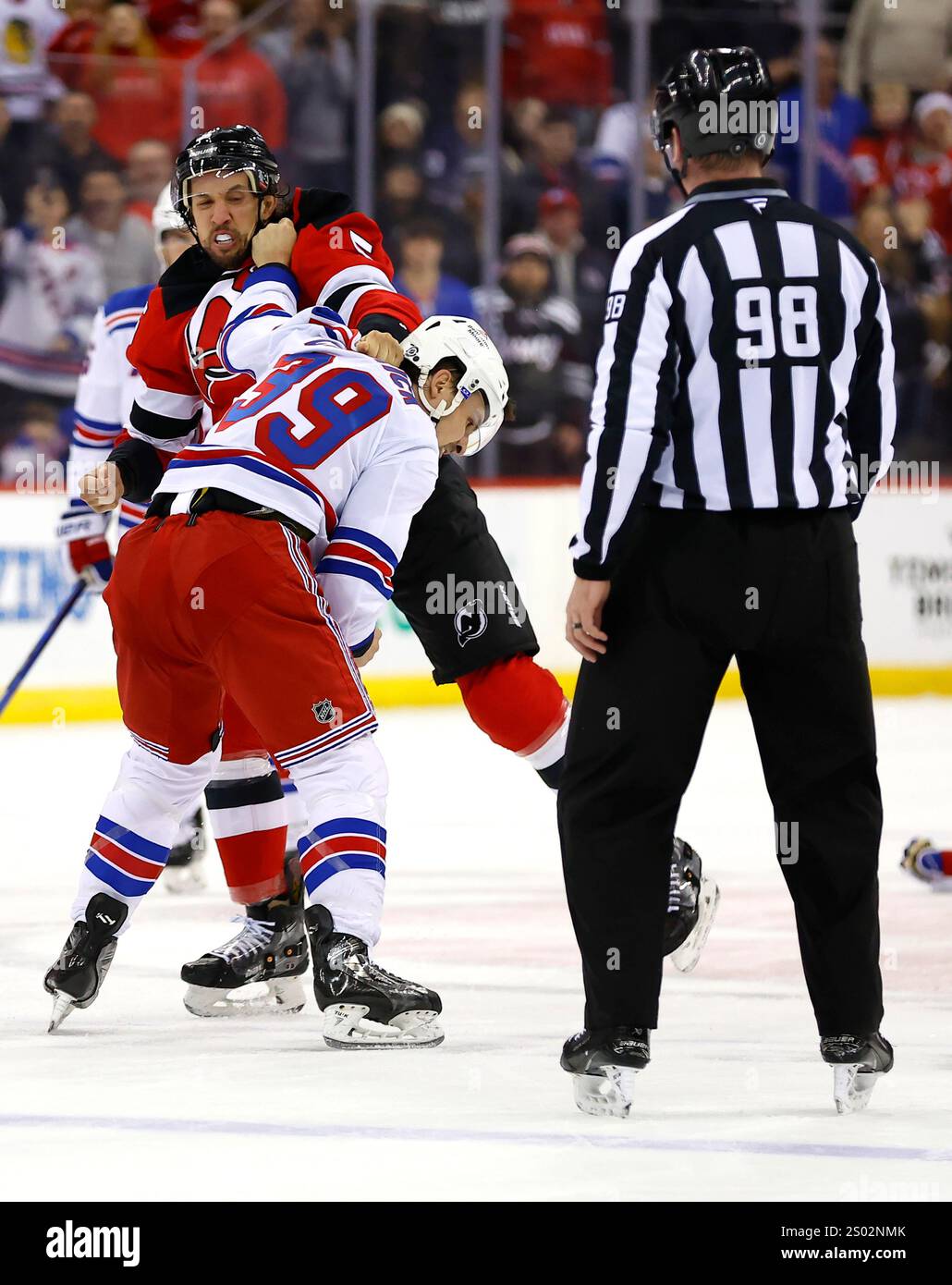 New York Rangers center Sam Carrick (39) and New Jersey Devils ...