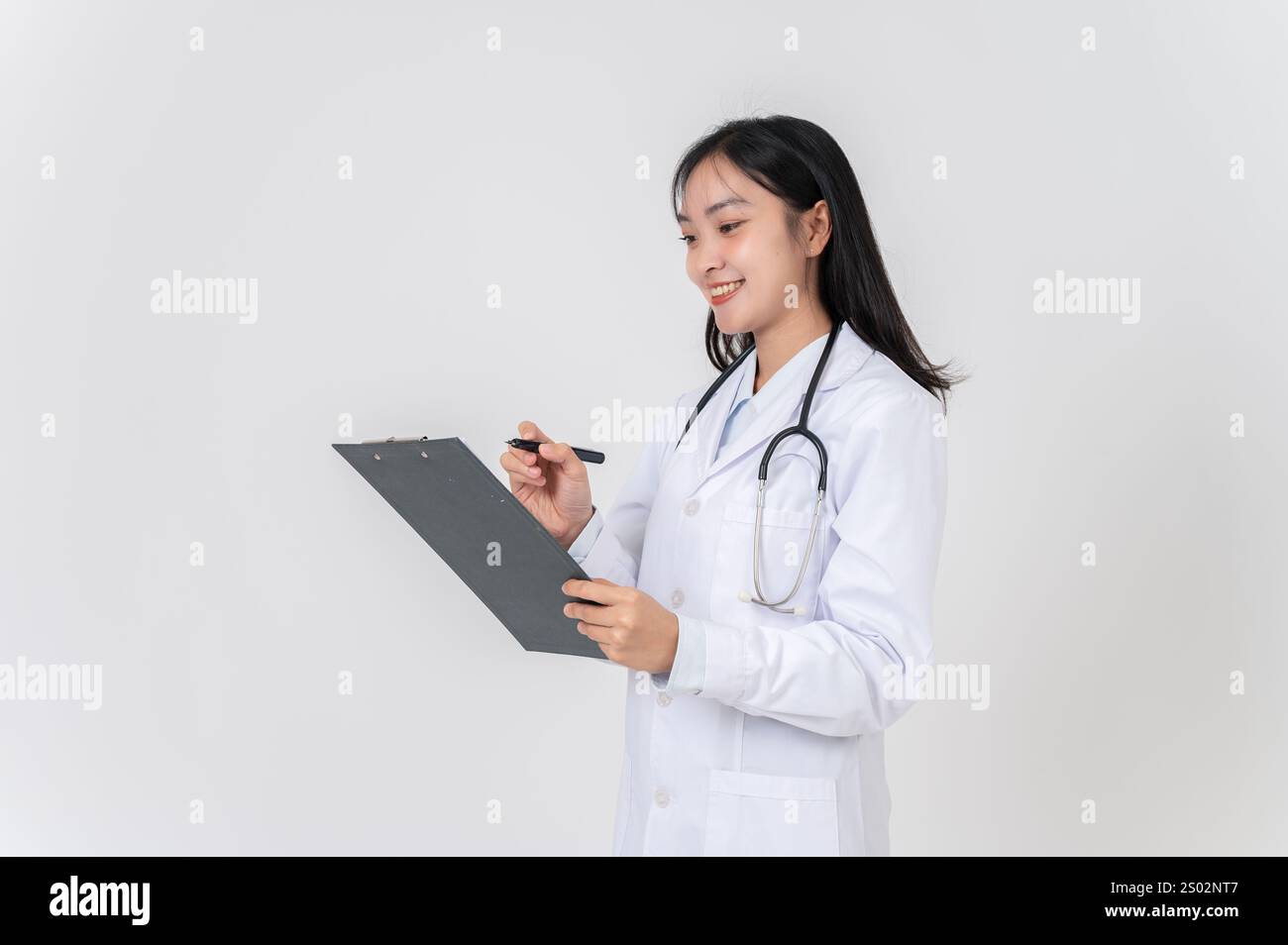 A beautiful Asian female doctor in a uniform checking medical cases on ...