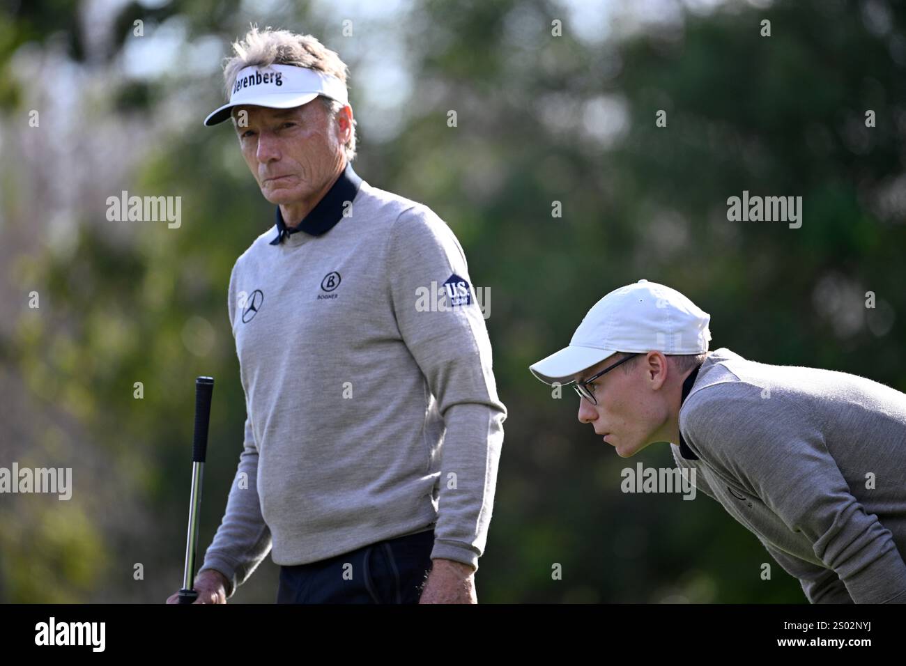 Bernhard Langer, left, and his son Jason Langer line up a putt on the ...