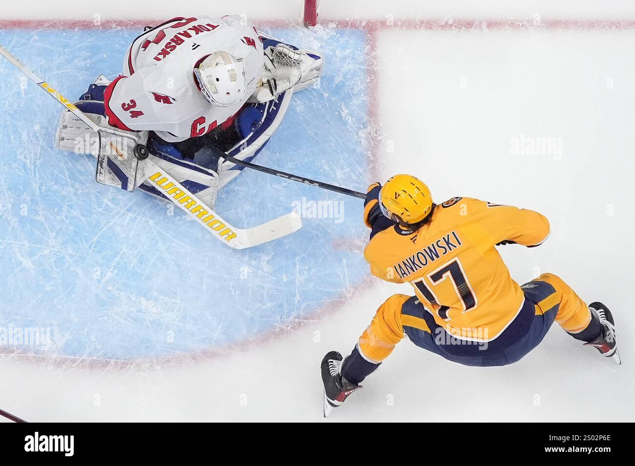 Carolina Hurricanes goaltender Dustin Tokarski (34) blocks a shot on ...