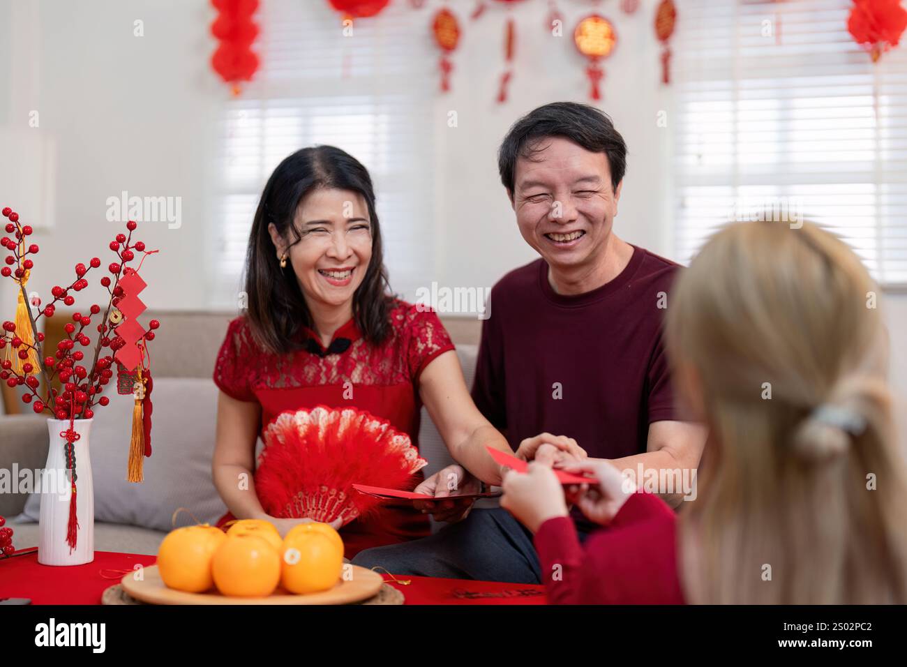 Celebrating chinese new year with family grandparents and granddaughter ...