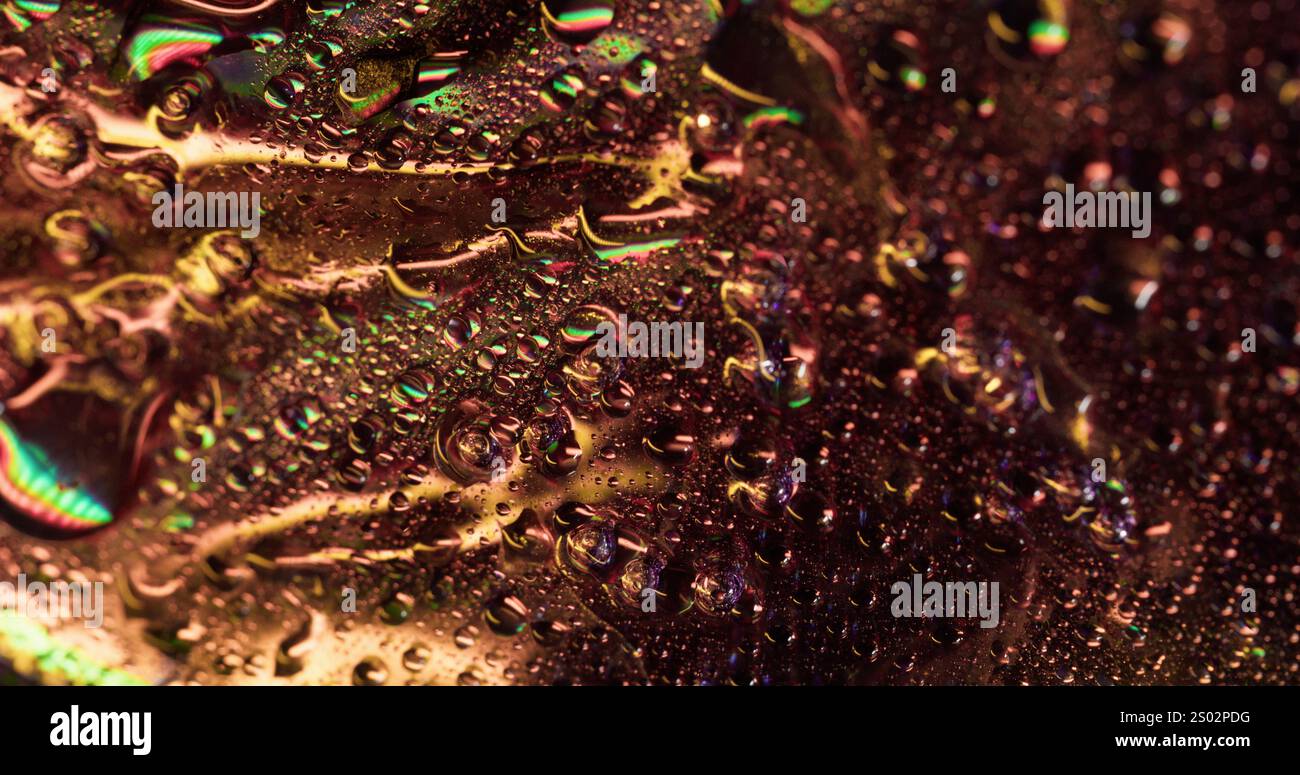 Raindrop surface. Wet texture. Copper illuminated shiny defocused area ...