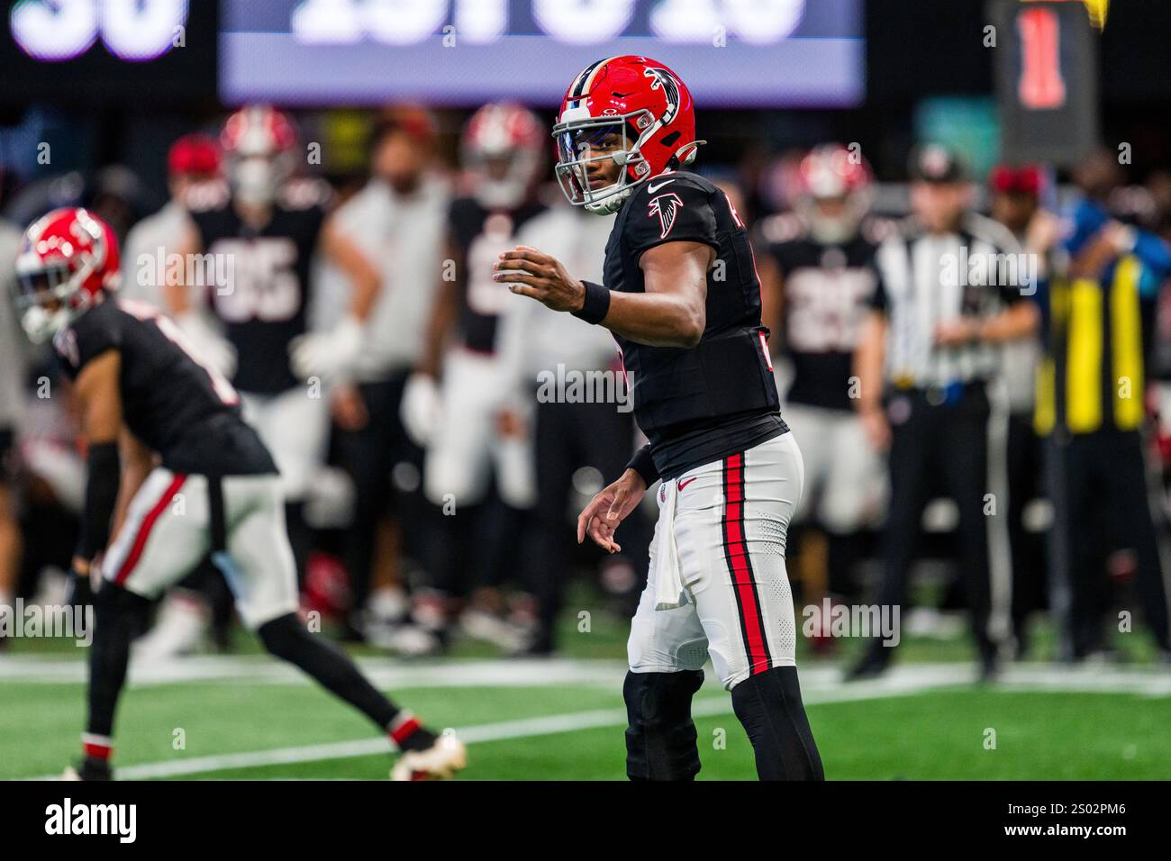 Atlanta Falcons quarterback Michael Penix Jr. (9) signals during the ...