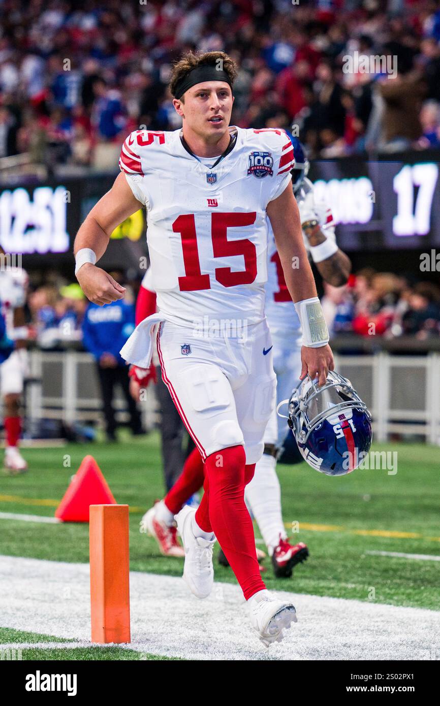 New York Giants quarterback Tommy DeVito (15) walks back to the locker ...