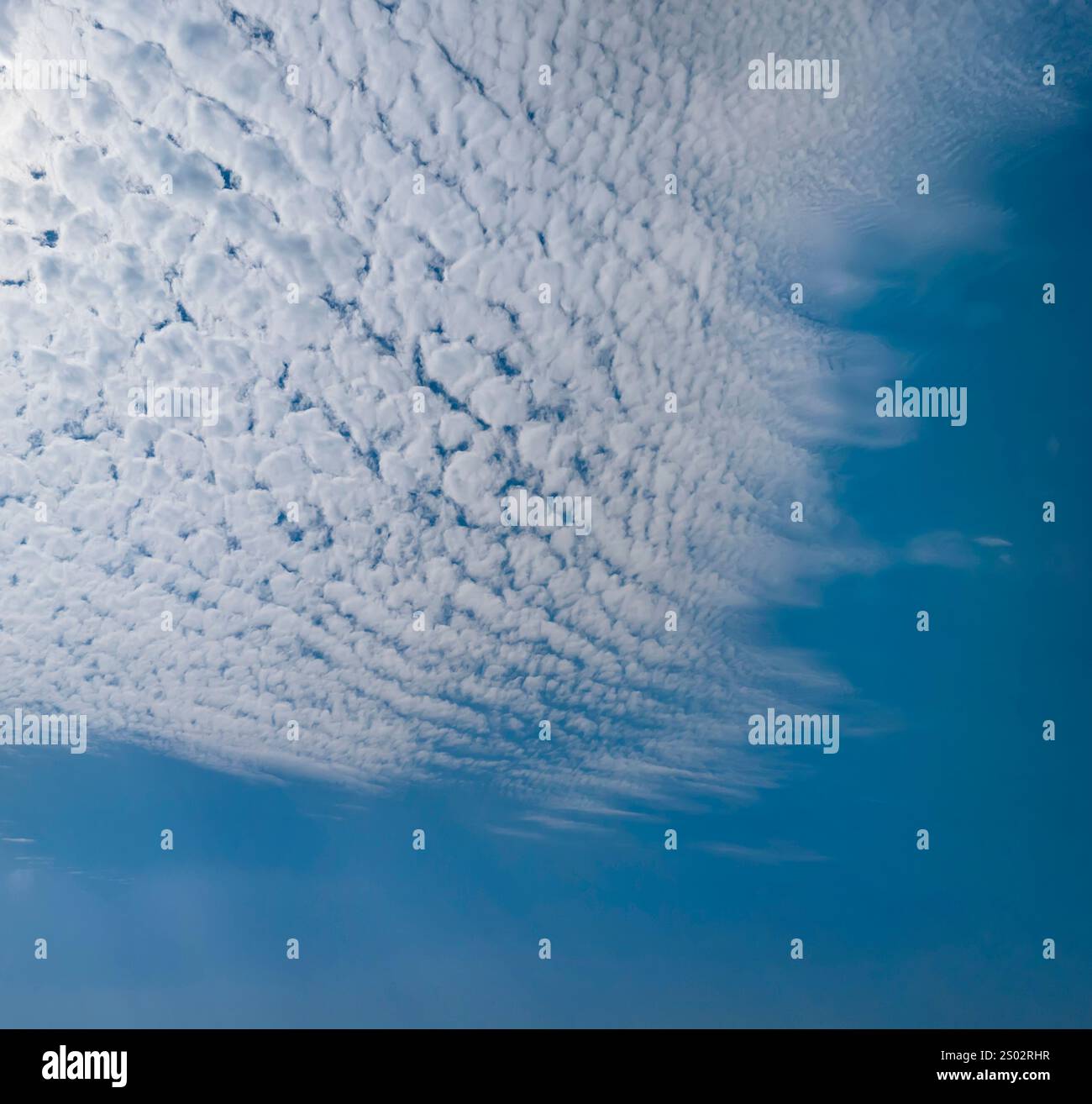 blue sky background with tiny clouds Stock Photo - Alamy