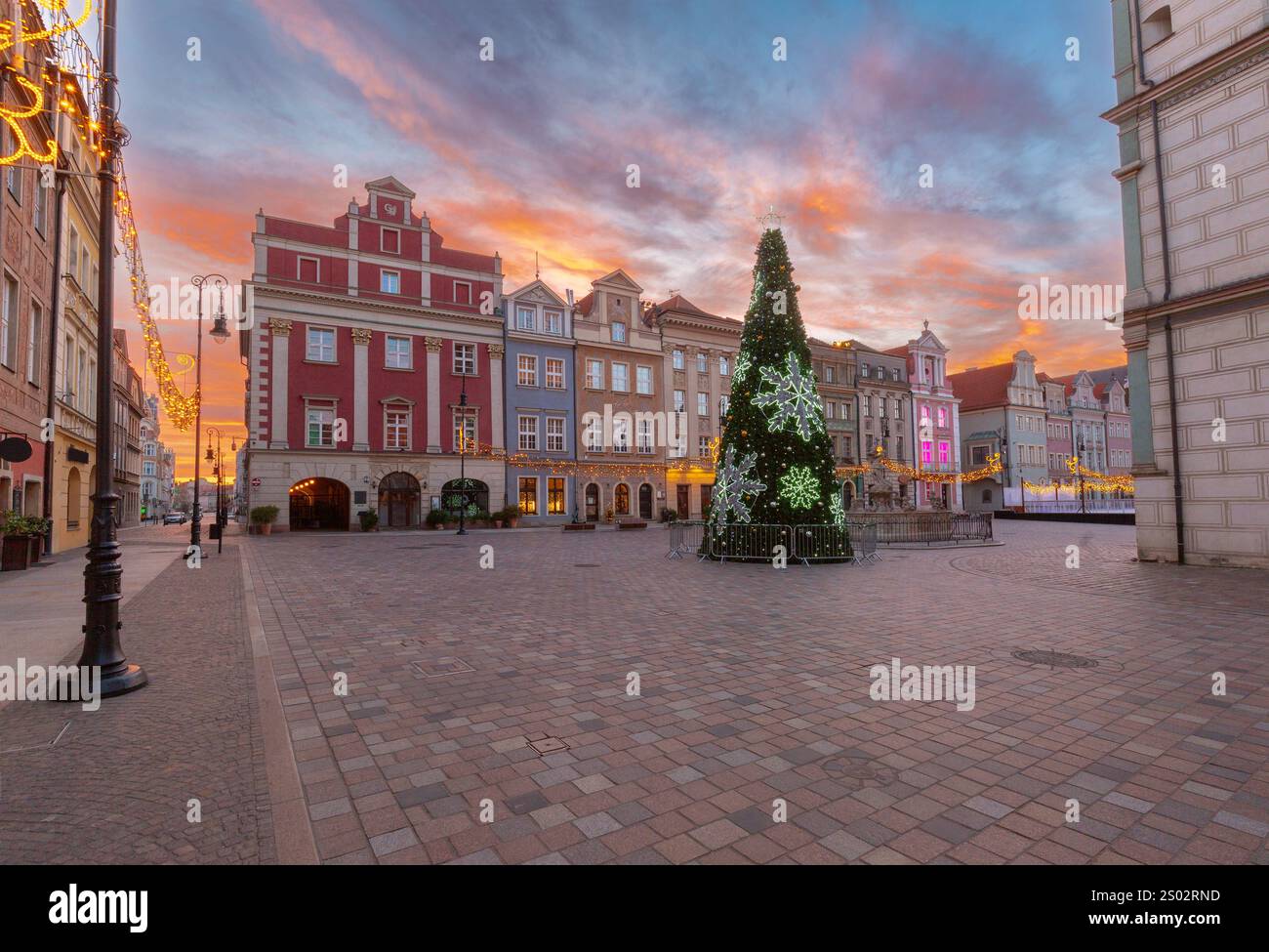 Christmas tree with festive decorations and lights in the old market ...